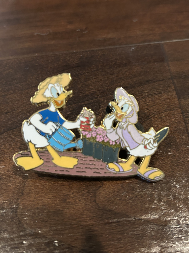 76665 - Donald and Daisy gardening - May Flowers Mystery - Disney Store ...
